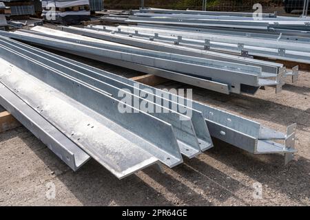 Stacked grey metal tin profiles at a construction site Stock Photo - Alamy
