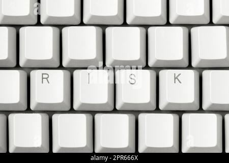 Risk lettering on white key on computer keyboard Stock Photo - Alamy