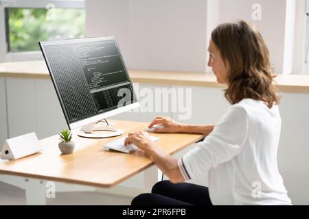 Software Programmer Or Coder Woman Using Office Computer Stock Photo ...