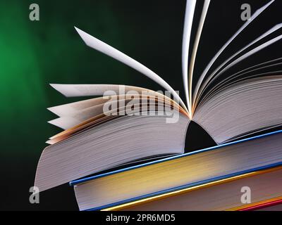 Composition with open book on the table Stock Photo - Alamy