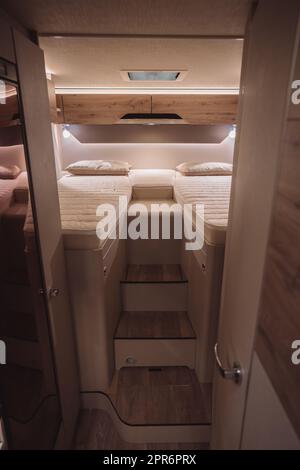 Bed inside a new luxury camper van motorhome Stock Photo - Alamy