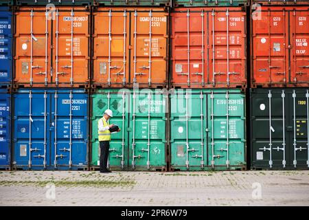 Concentration and hard work is key. A customs inspector standing and ...