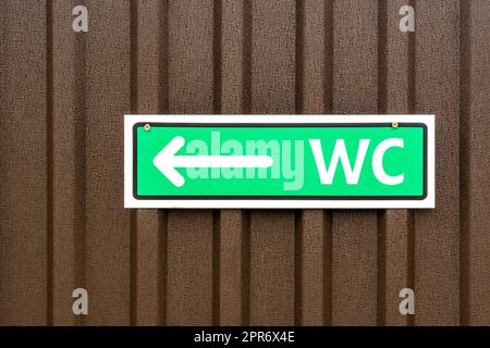 Green sign of public toilets WC Stock Photo - Alamy