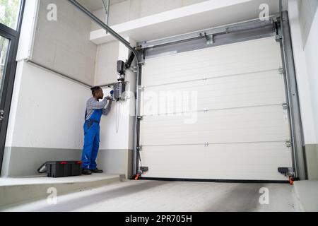 Installing Automatic Garage Door Or Gate. Maintenance And Repair Stock ...