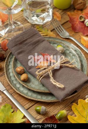 Autumn rustic table setting between leaves and berries on vintage ...