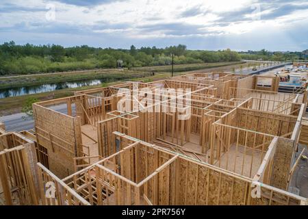 Aerial view the construction wood framing beams of a new house under construction Stock Photo ...