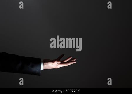 Businessman Reaching Up and Holding an Object Stock Photo - Alamy