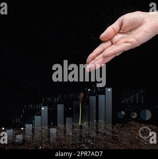 Green sprout on the ground and a graph with growing indicators on a ...