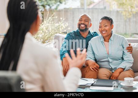 The best weve ever seen. a mature couple meeting with their insurance ...