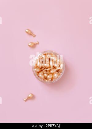 Top view of unbranded light pink squeeze cosmetic tube with black cap ...