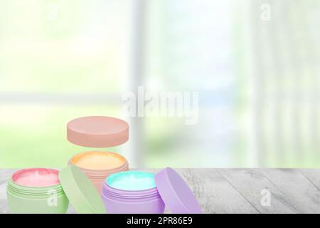 Top view of a table with colorful face masks piled and space to copy ...
