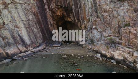 Sea cave with koi fish in Hong Kong Geopark Stock Photo - Alamy