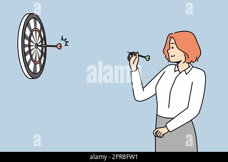Girl throwing darts at target at wall. Businesswoman aiming arrow at ...