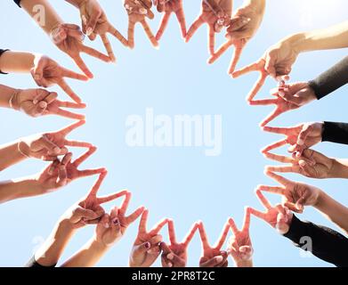 Hands together forming a star Stock Photo - Alamy