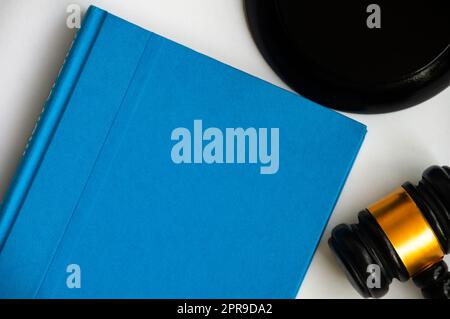 Blue cover book and gavel with space customizable for text or ideas ...