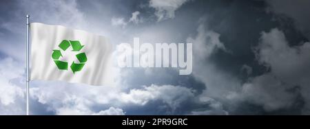 recycling symbol flag on a cloudy sky Stock Photo - Alamy