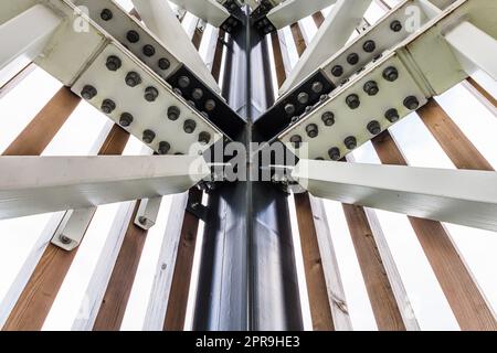 Massive steel beams end-to-end with bolts and nuts on the construction ...