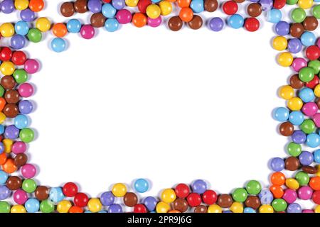 Frame border of multi coloured halloween candy sweets on white Stock ...