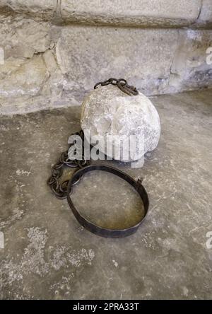 An prison inmate with a ball and chain Stock Photo - Alamy