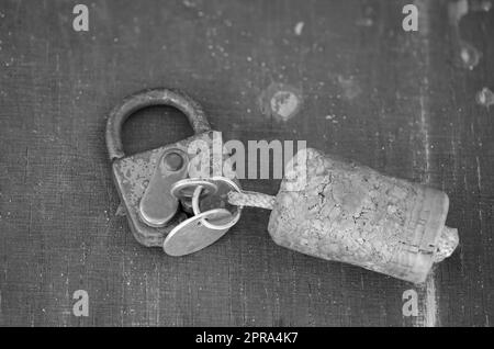 One key for one lock, padlock with cork tag Stock Photo - Alamy