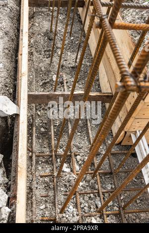 Reinforcement covered with earth during the collapse of the formwork ...