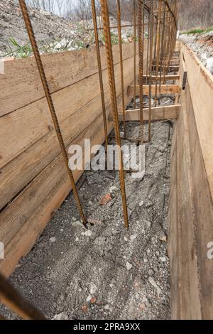 Foundation trench with reinforcement for the construction of the fence ...