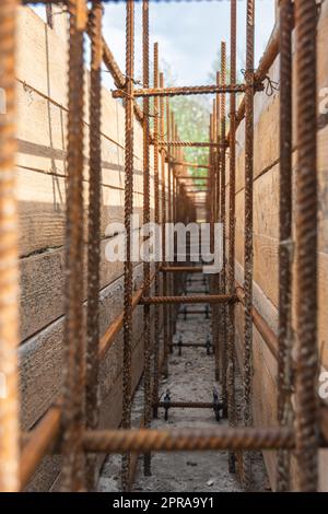 Foundation trench with reinforcement for the construction of the fence ...
