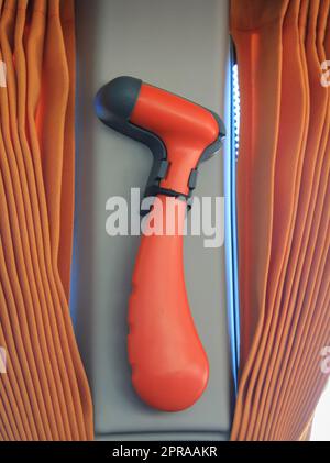 An emergency hammer, emergency hammer or glass breaking hammer in a bus ...