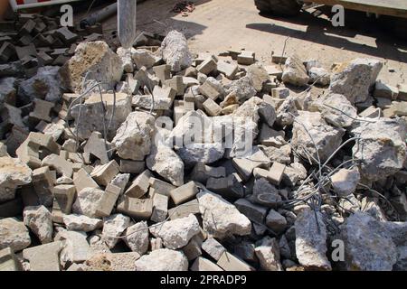 Concrete residues from building rubble were crushed with a chisel Stock ...