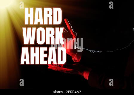 Hand writing sign Hard Work Ahead. Business overview A lot of job ...