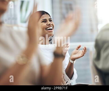 Feeling inspired. a group of people clapping and smiling during a ...