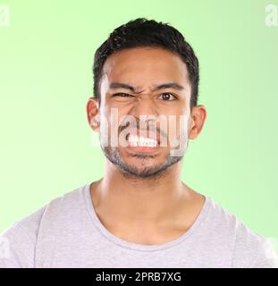 Sometimes you just gotta grit your teeth. Cropped portrait of a ...