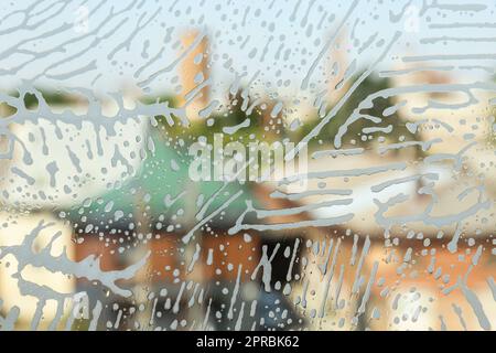 Glass covered with suds as background, view from inside Stock Photo - Alamy
