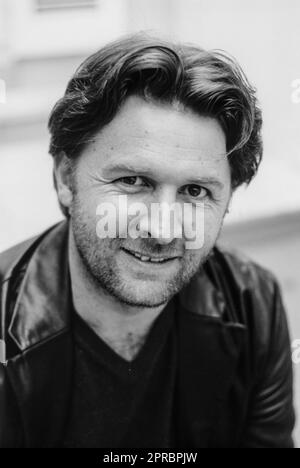 Australian actor and director John Polson black and white formal ...