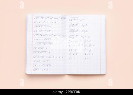 Copybook with maths formulas on beige background with space for text ...