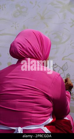 The process of making batik on Festival Batik Keren Blitar. Batik is a ...