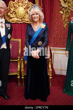 A new Queen Consort wax figure (2nd right) is added to existing figures ...