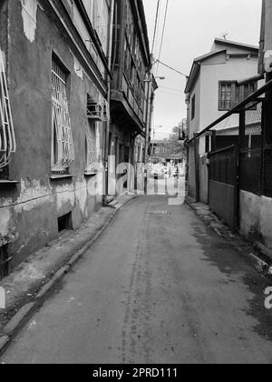Beautiful old brown dilapidated three-story house with windows and ...