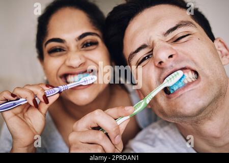 Couple who brush together, stay together. a young couple brushing their ...