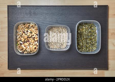 Nuts and seed in boxes Stock Photo - Alamy