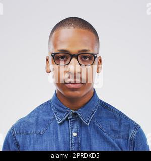 Hes impossible to read. Studio portrait of a handsome young man posing ...