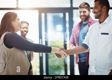Business people giving handshake, welcoming new employee and standing ...