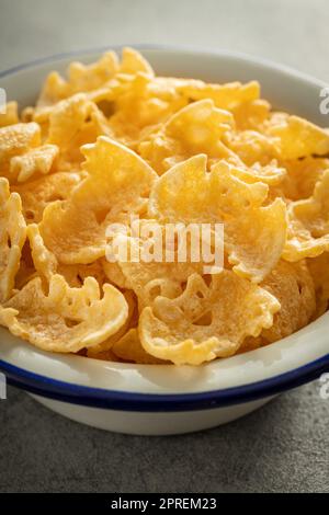 Halloween crispy bat shaped chips in the bowl Stock Photo - Alamy