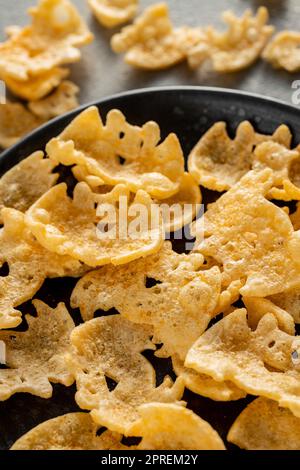 Halloween crispy bat shaped chips on the wooden table Stock Photo - Alamy