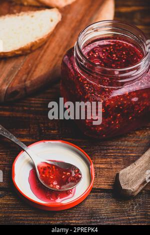 Jar of homemade raspberry jam. Toasts for breakfast Stock Photo - Alamy
