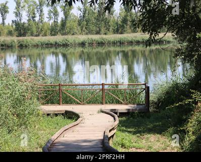 wooden path bound for the river safe walk Stock Photo - Alamy