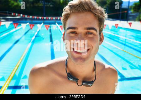 Swimmings my passion. Cropped portrait of a smiling male swimmer ...