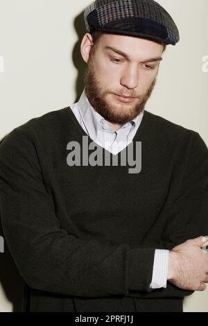 Rugged kind of charm. A thoughtful young man posing for a studio shot ...