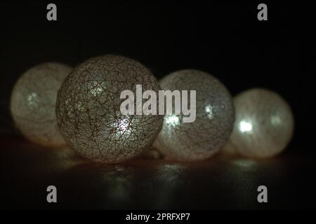 Luminous balls for decoration. Garlands glow in dark. Transparent ...