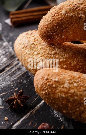 Close up of bagel buns at holiday fair. Bunch of sweet ring bun pastry ...